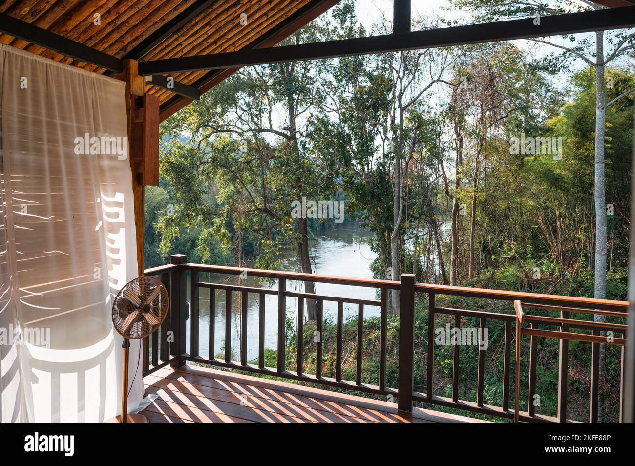 Tropical rainforest and river view from wooden balcony of the resort on ...