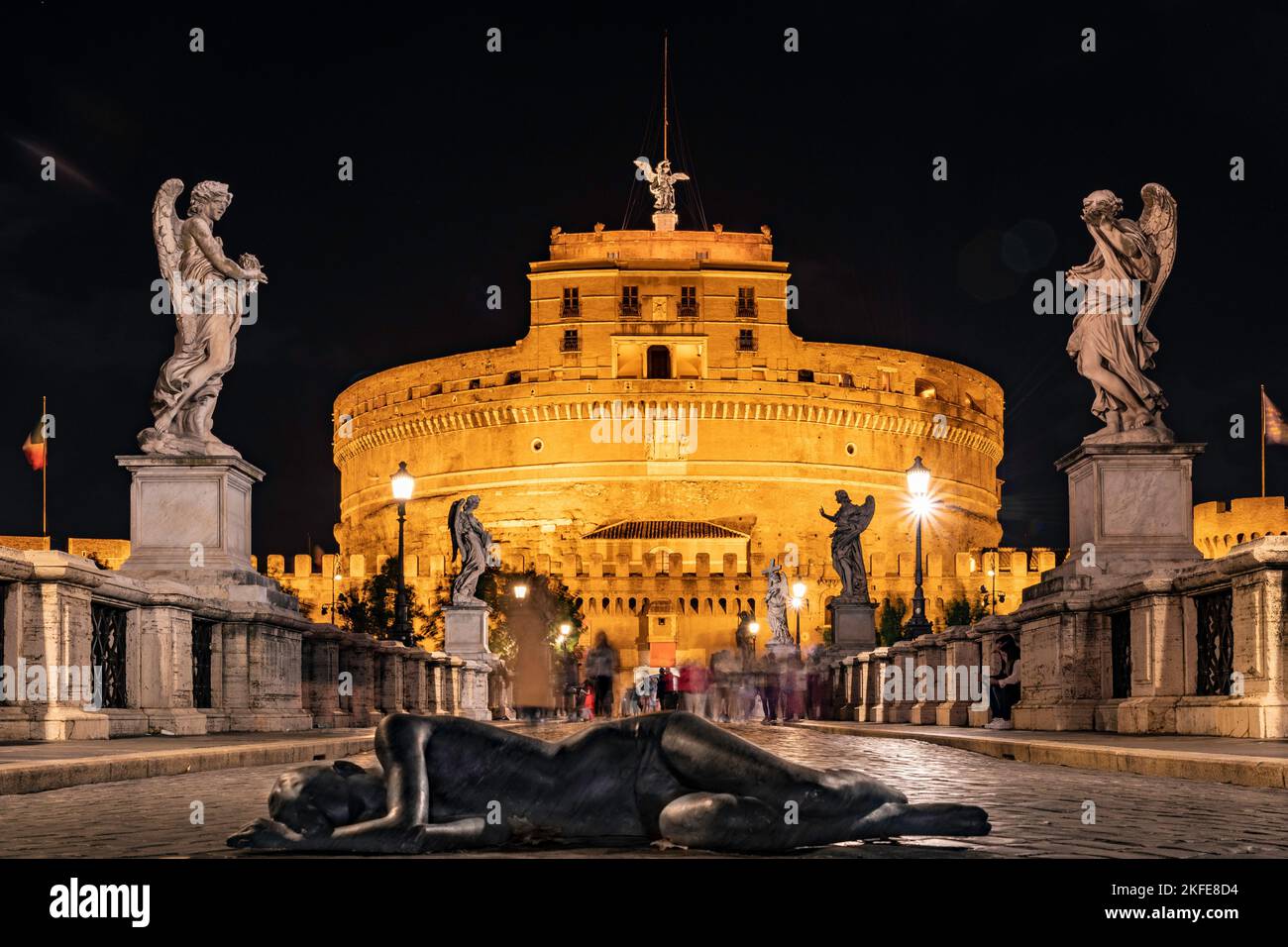 The Castle of the Holy Angel at night with statues of angels in the foreground, Rome, Italy ...