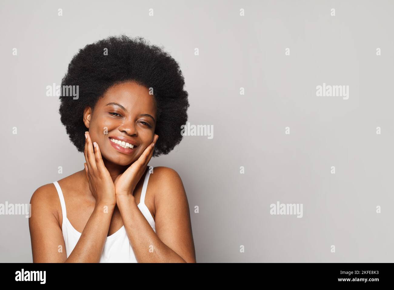 Closeup portrait of cute gorgeous woman touching cheeks with delight ...