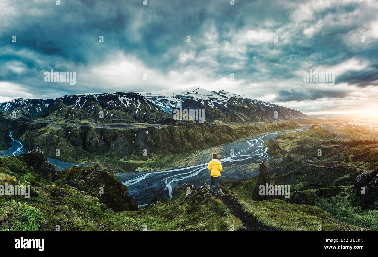 Panorama dramatic view of hiker standing on top of Valahnukur viewpoint ...