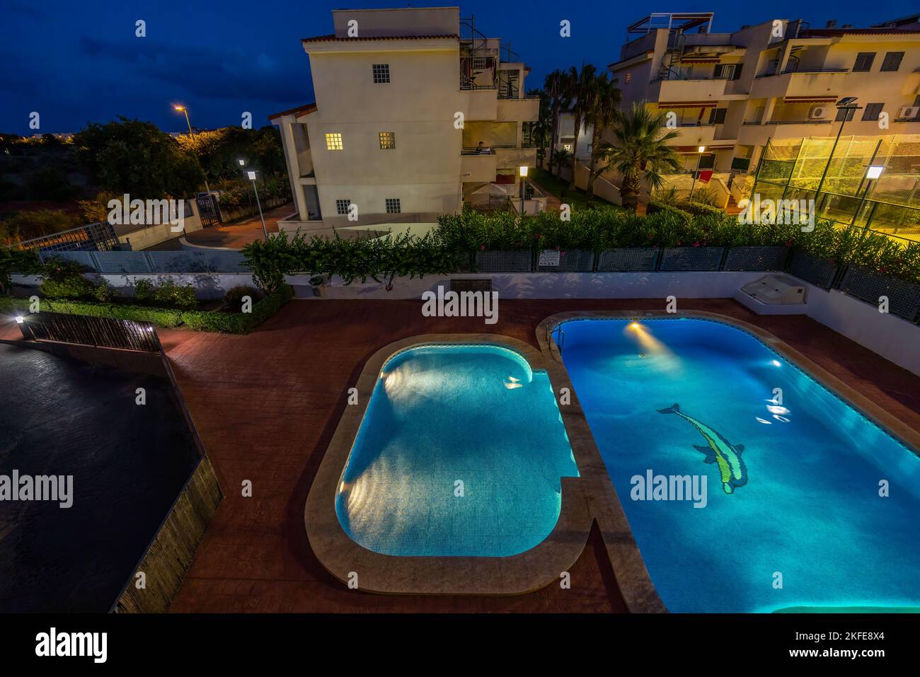 illuminated swimming pools at night Stock Photo - Alamy