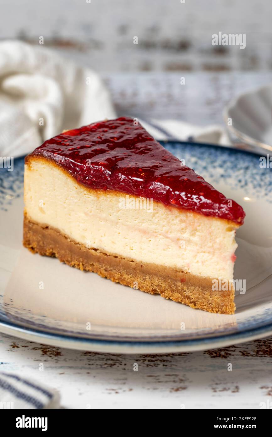 Raspberry Cheesecake on a white wooden background. New York cake ...