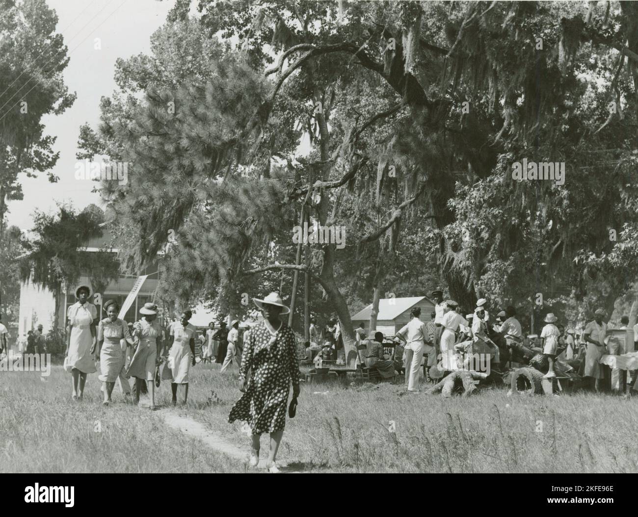 African Americans walking in an open field at a picnic, Beaufort, South ...