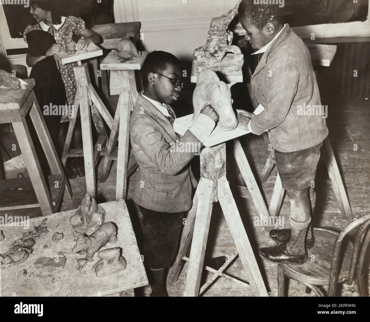 Boys sculpting a horse, Harlem Community Art Center, 1937 Stock Photo ...