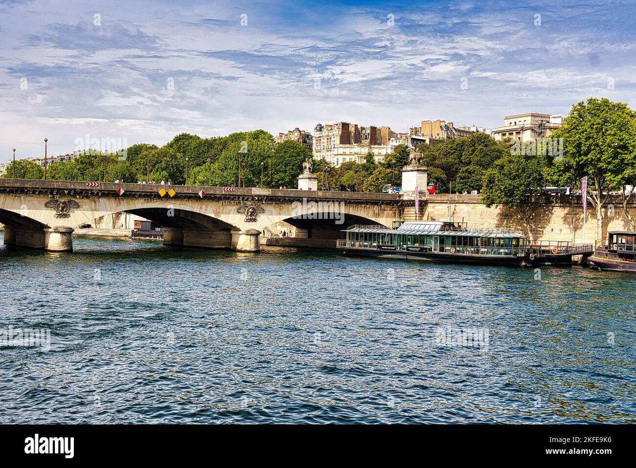 The ancient Pont Alexandre III deck arch bridge spanning the Seine in ...