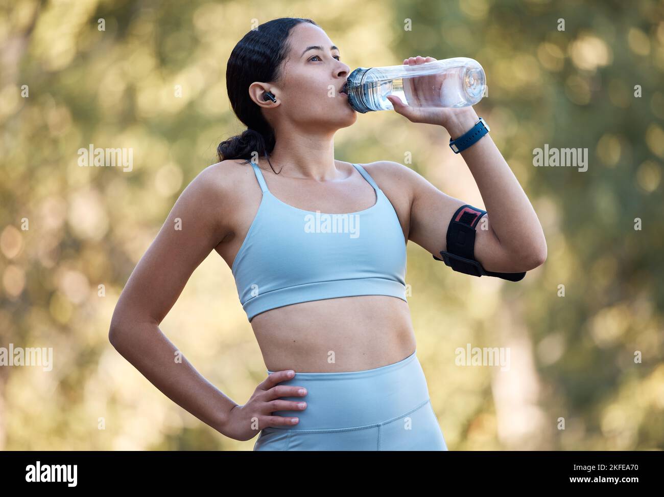 Woman, fitness and drinking water for wellness, health and hydration ...