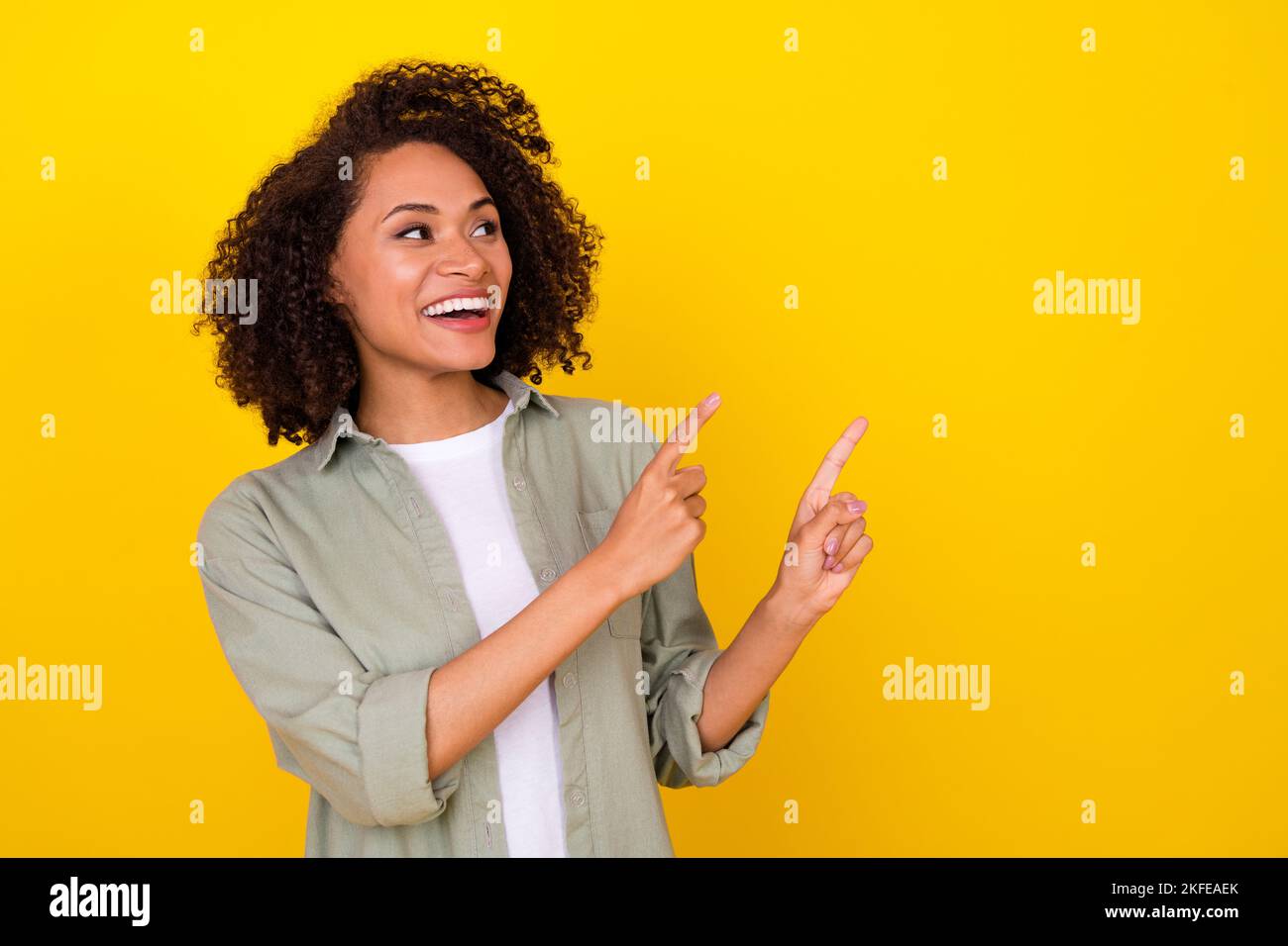 Photo of amazed excited lady point empty space impressed ads offer ...