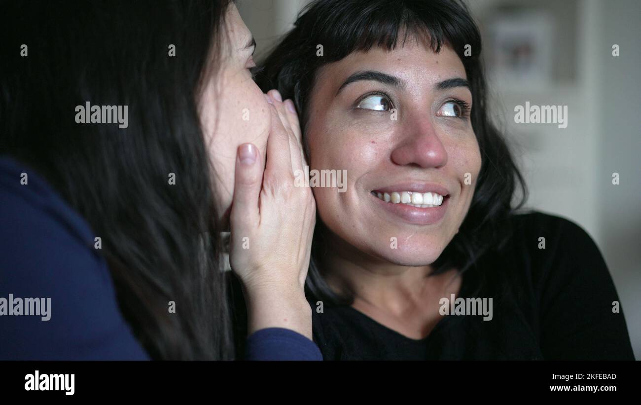 Friends sharing gossip whispering secret to woman ear telling SHOCKING ...