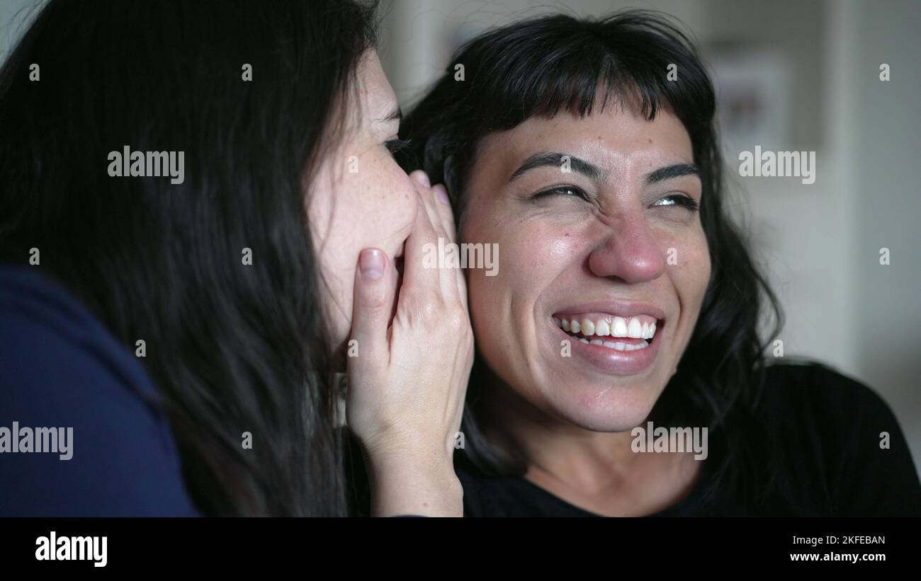 Friends sharing gossip whispering secret to woman ear telling SHOCKING ...