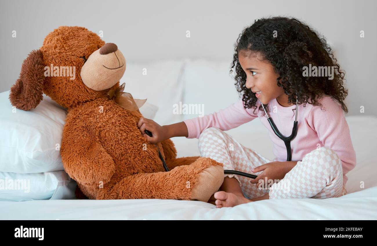 Teddy bear, learning and child with stethoscope for healthcare, heart ...