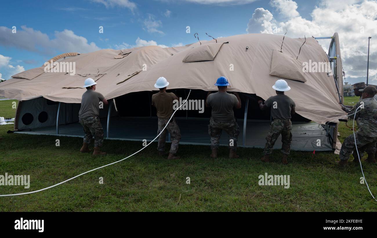 U.S. Air Force Airmen assigned to the 36th Wing assemble a tent during ...