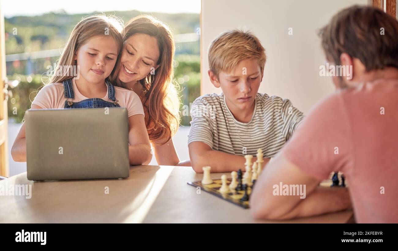 Family, parents and kids with laptop, chess and learning together in ...