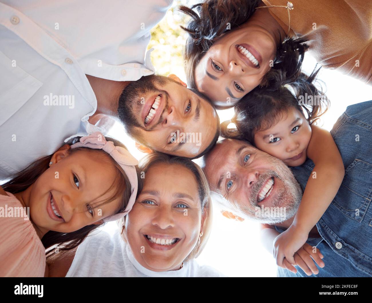 Happy, big family and portrait smile below for fun quality bonding ...