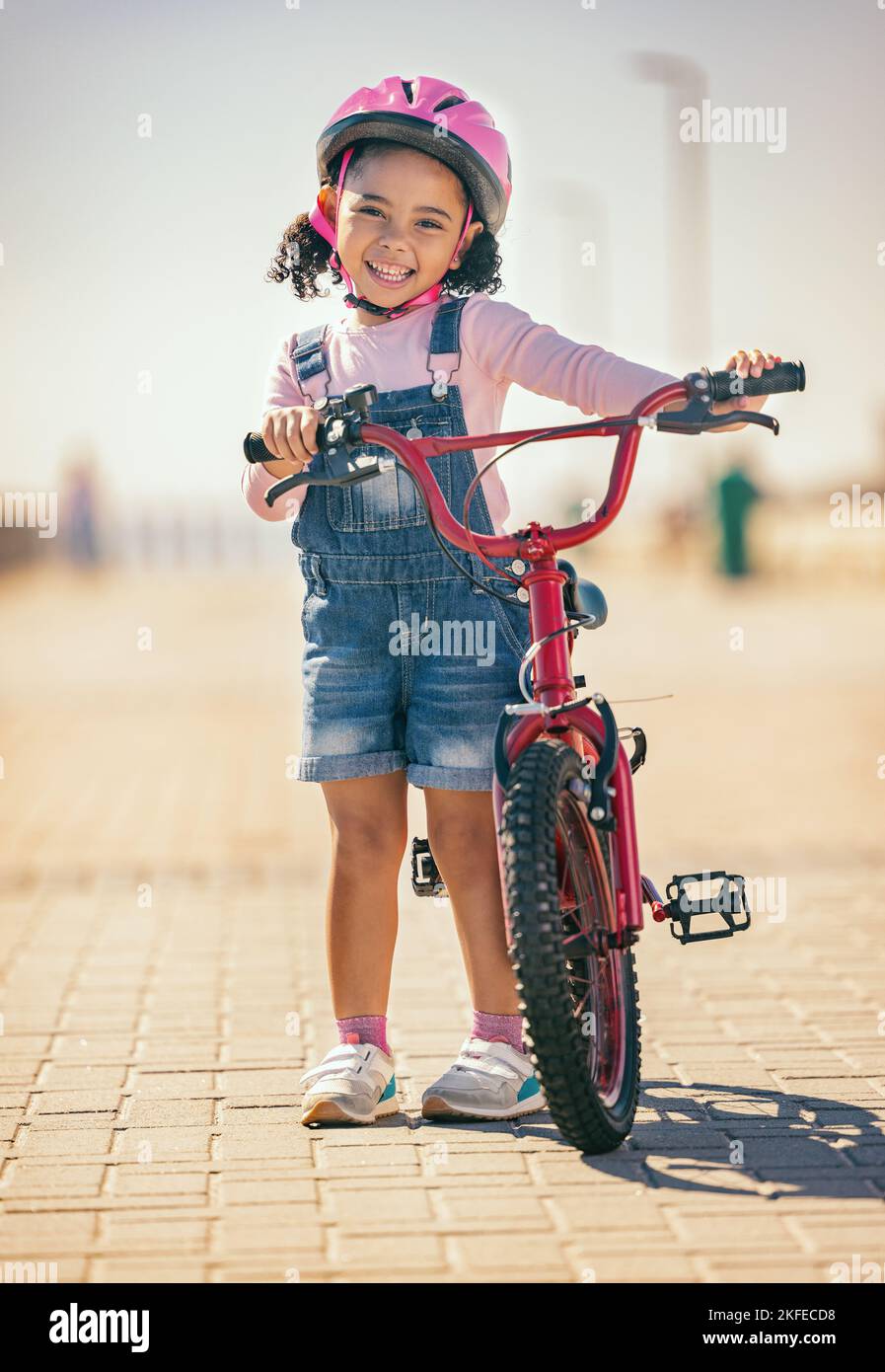 Girl, bike training and portrait, learning development and sports in ...