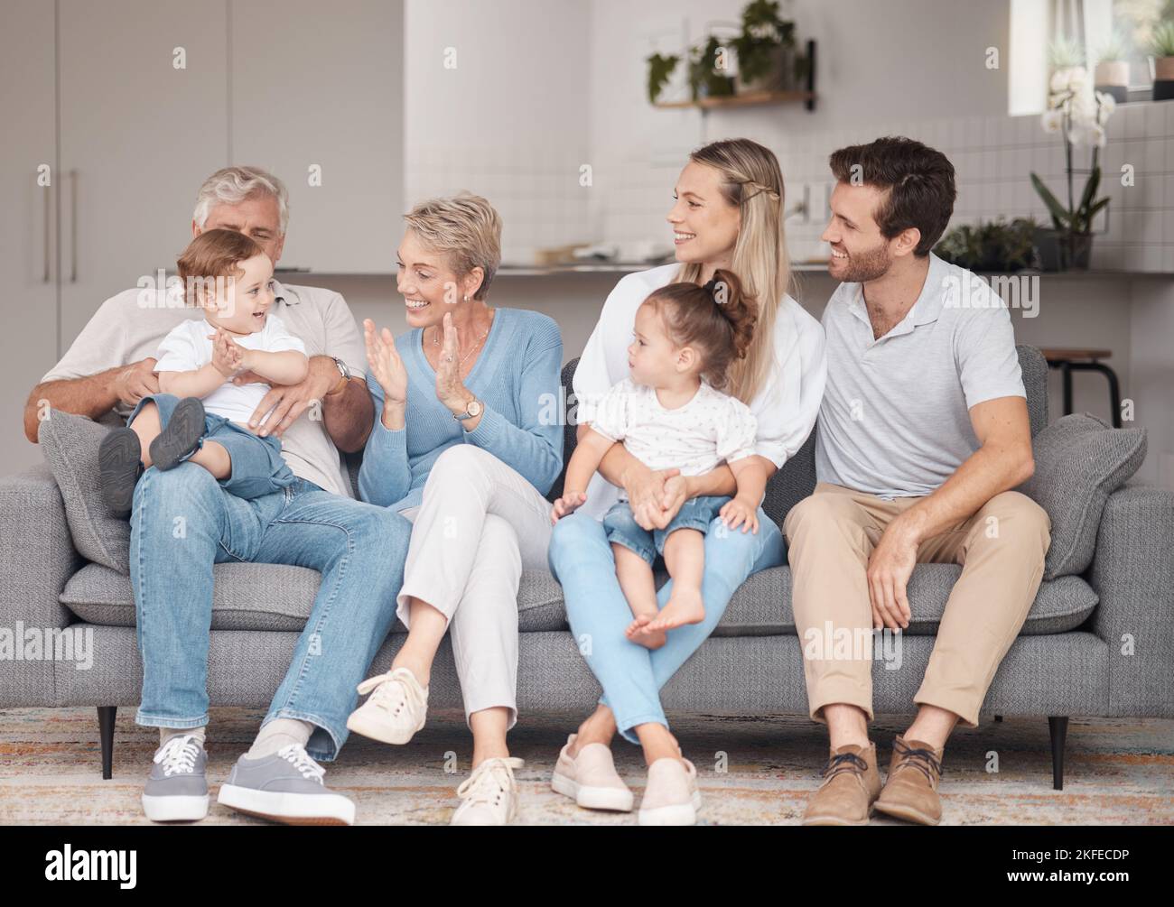 Big family, love and relax on sofa in home living room, bonding and ...