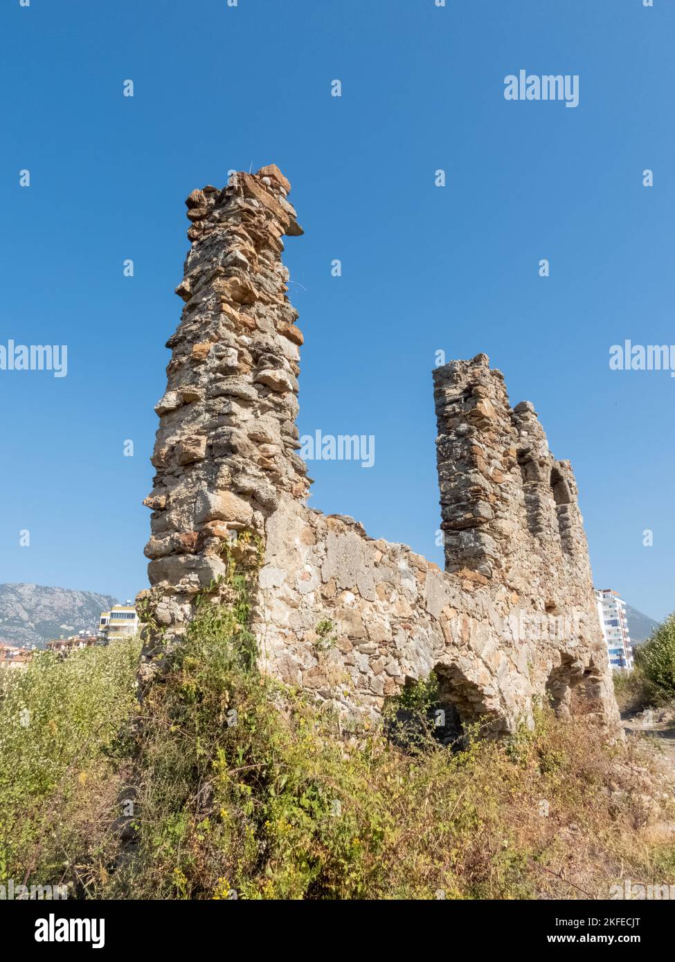 Fragment of an ancient building made of stones. Byzantine city of Naula ...