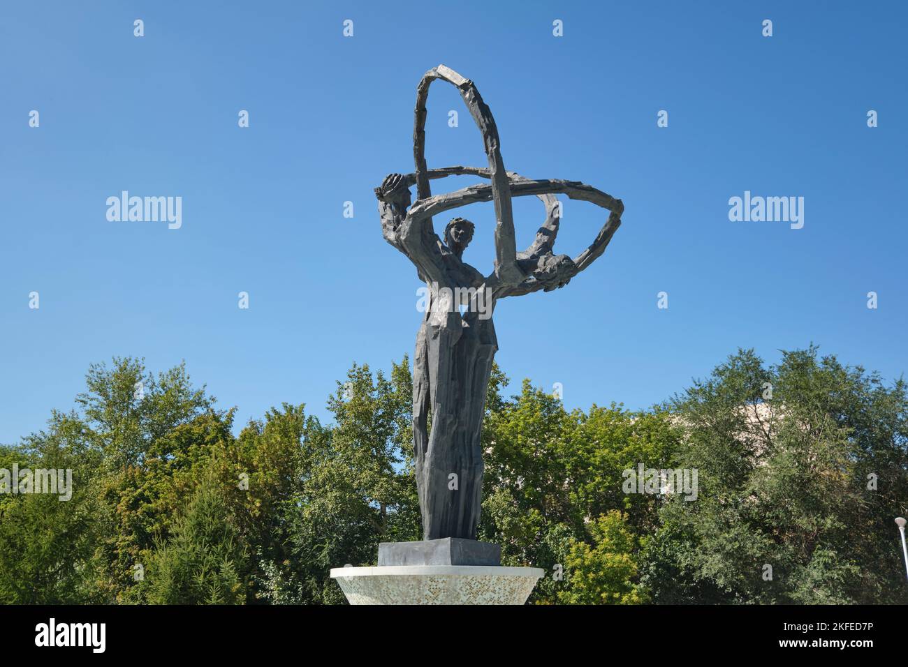A view of the semi-abstract design of people with interwined arms. At ...