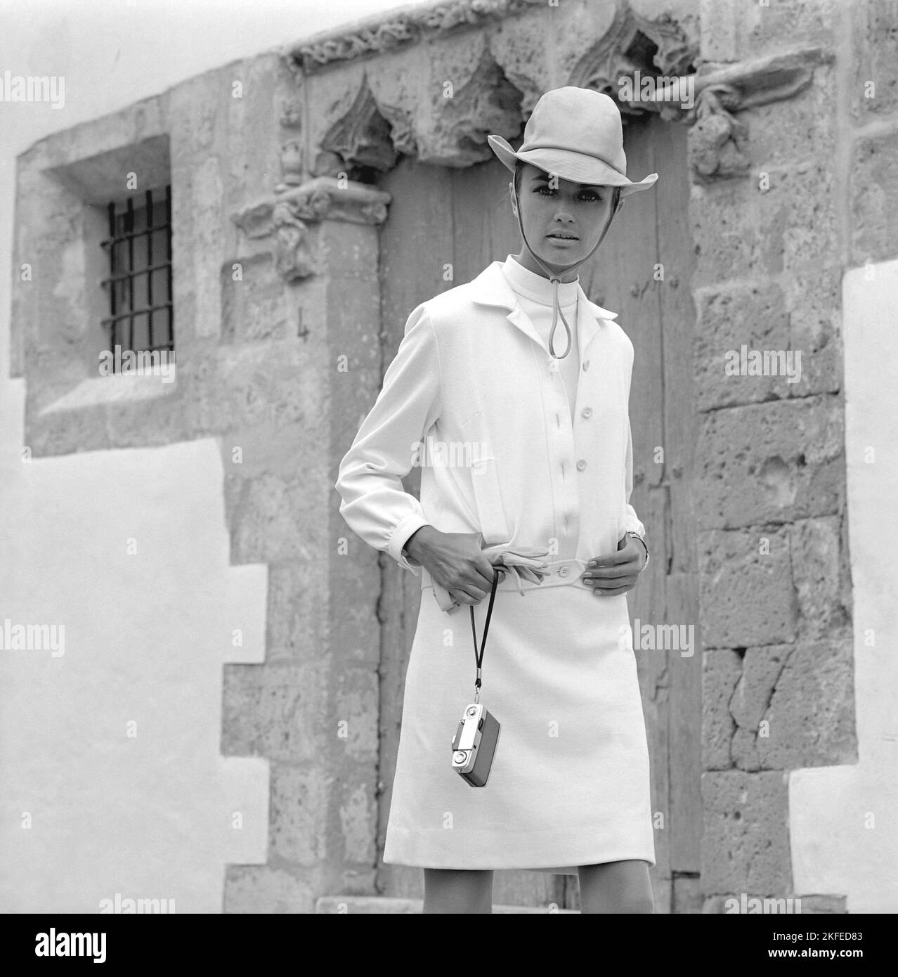 Fashion shoot on the spanish island Ibiza in the 1960s. A fashion model ...