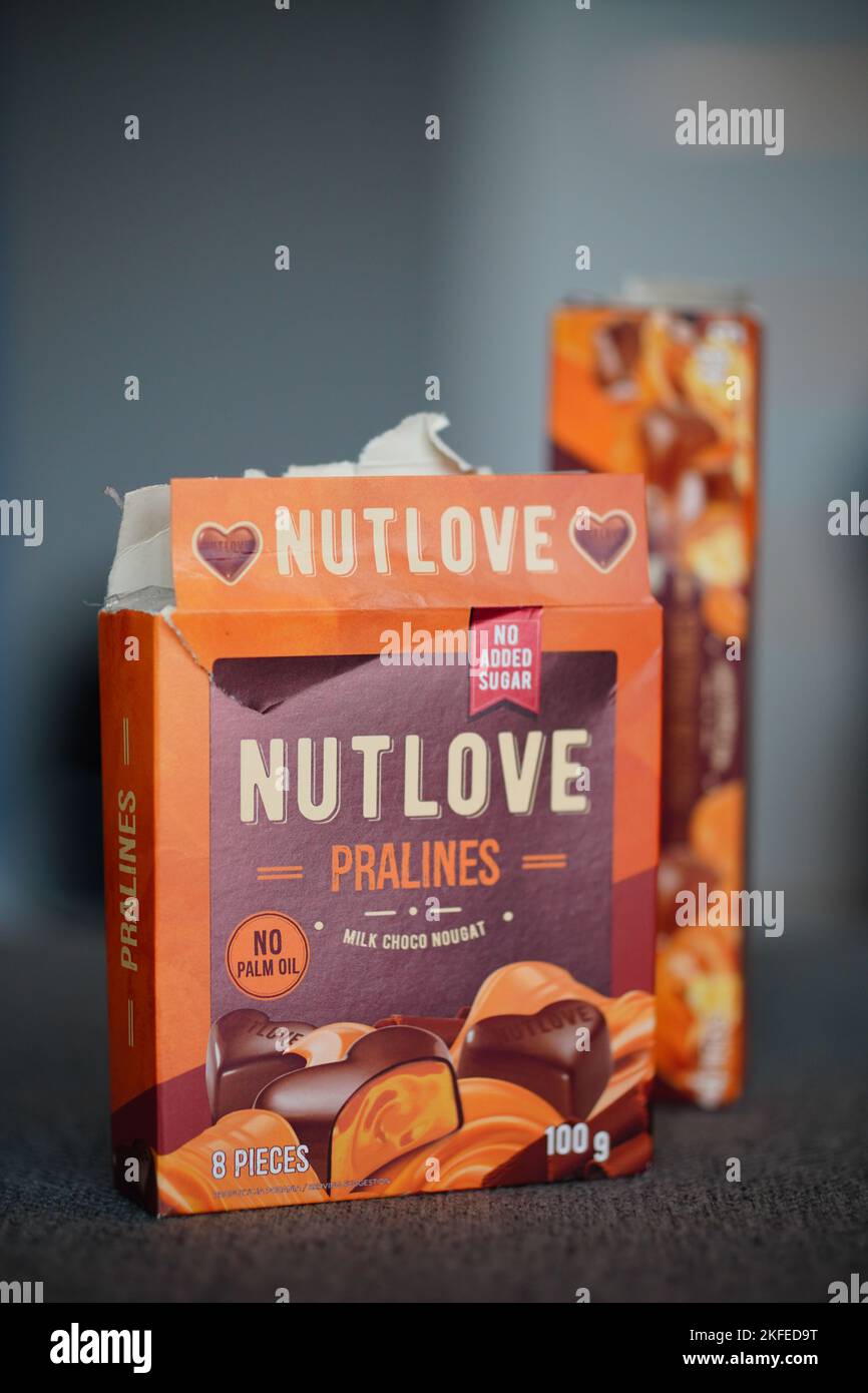 The Allnutrition NutLove brand pralines with caramel in an open box ...