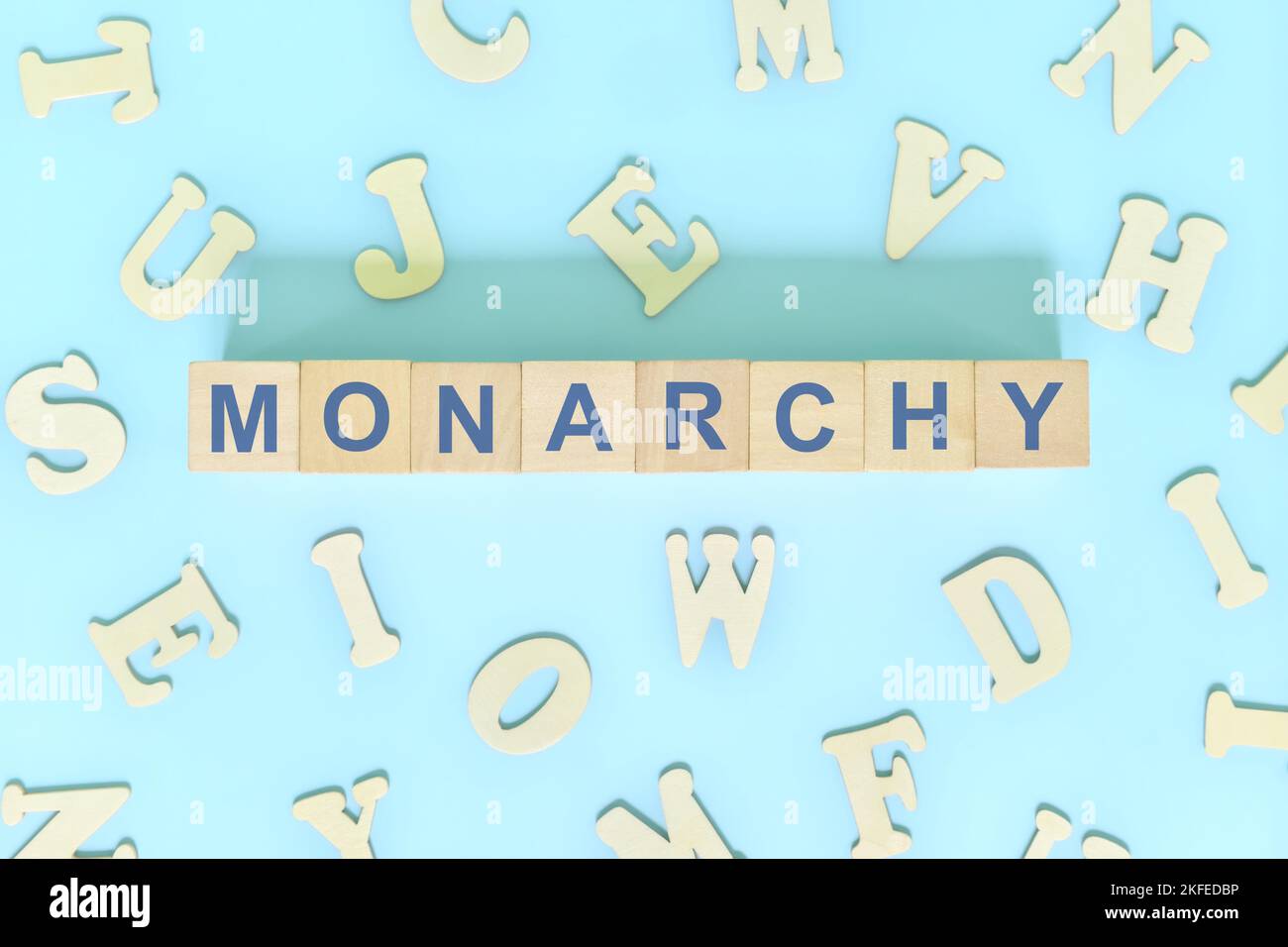 Monarchy government form concept. Wooden blocks typography flat lay in ...