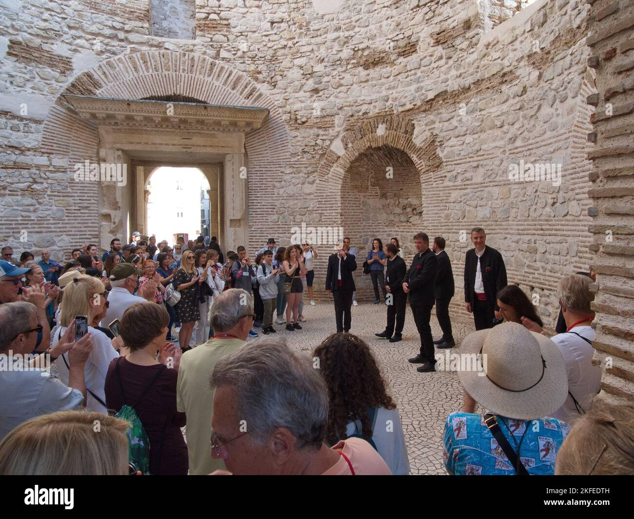 Local choir singing before a crowd of tourists by the Cathedral of St ...