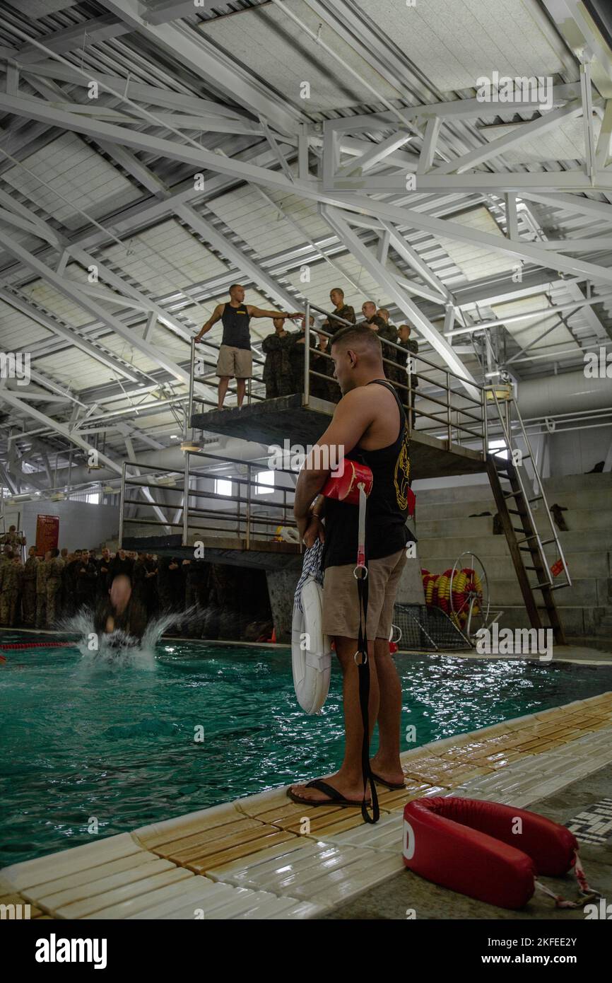 A U.S. Marine Corps Water Survival Instructor with Support Battalion ...