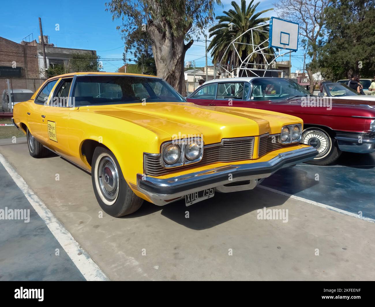 Old 1973 Pontiac Catalina 400 four door sedan yellow taxi cab in a park ...