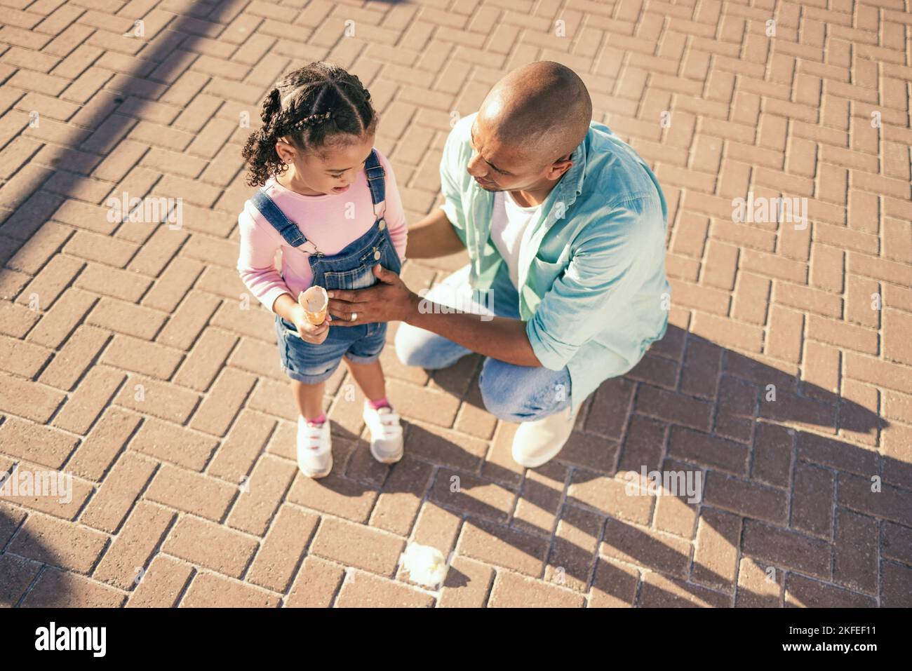 Summer, crying and girl with ice cream on floor standing with dad ...