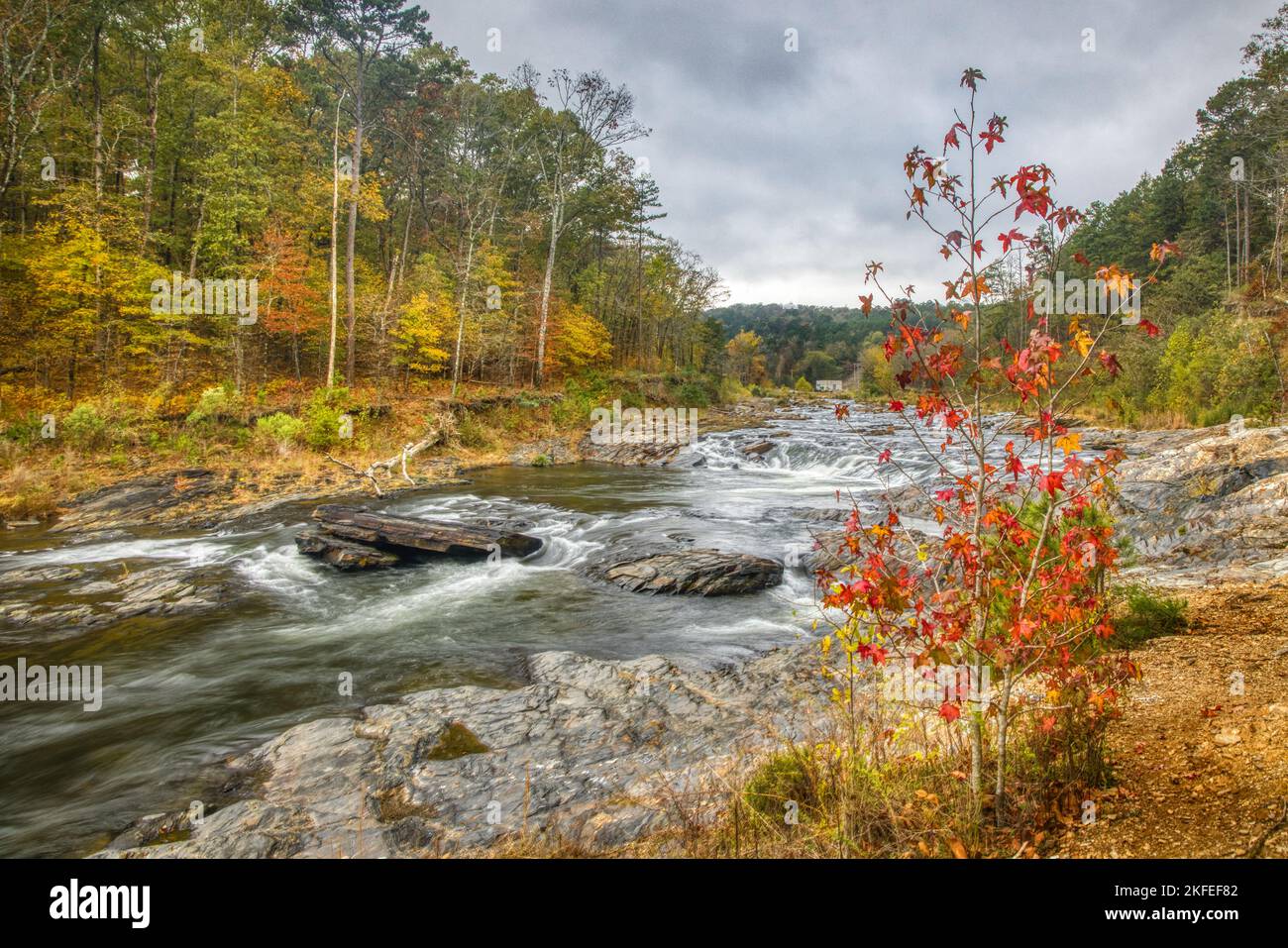 A closeup of water flowing in the Mountain Fork River of Beavers Bend ...