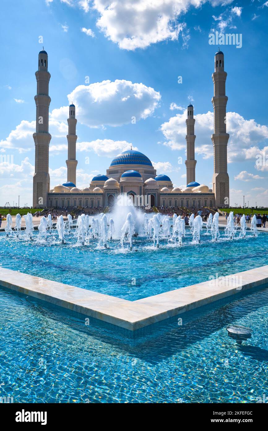 A view of the front entrance to the huge mosque, with a series of blue ...