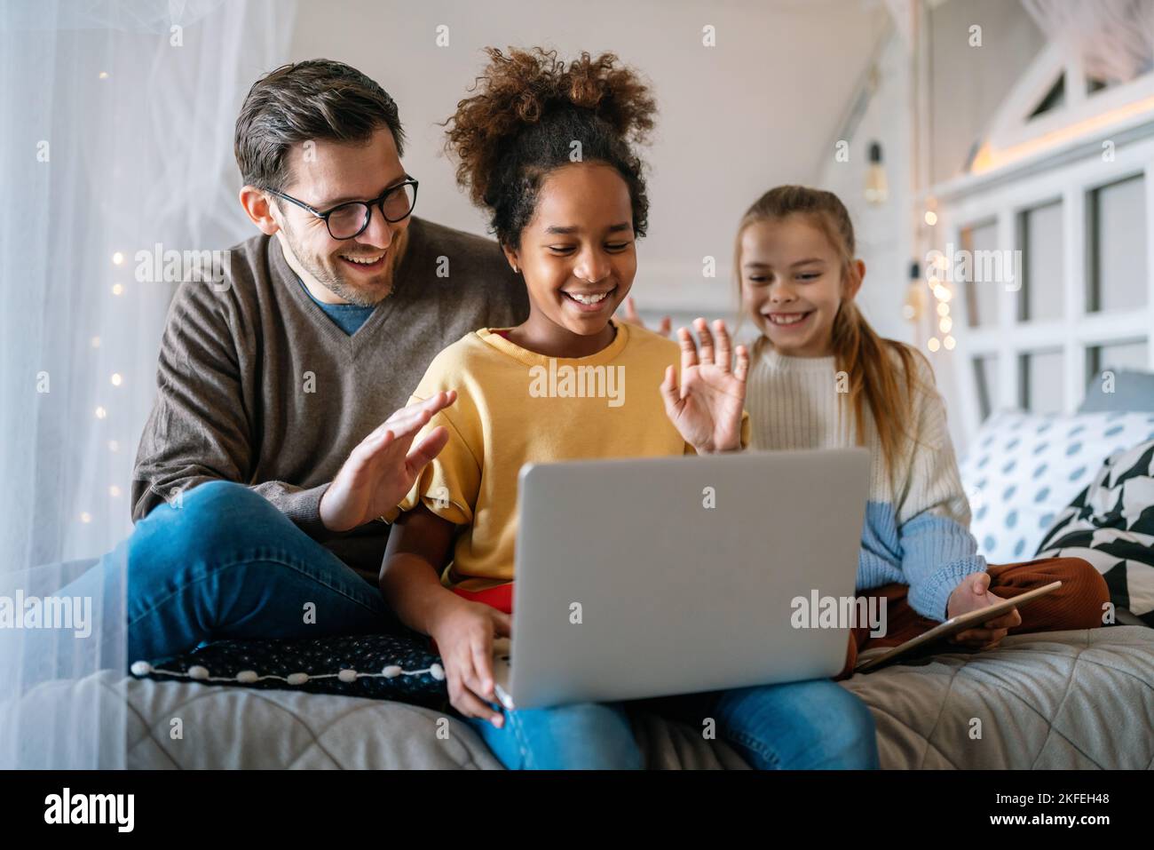 People, family and technology concept. Happy father with multiethnic ...