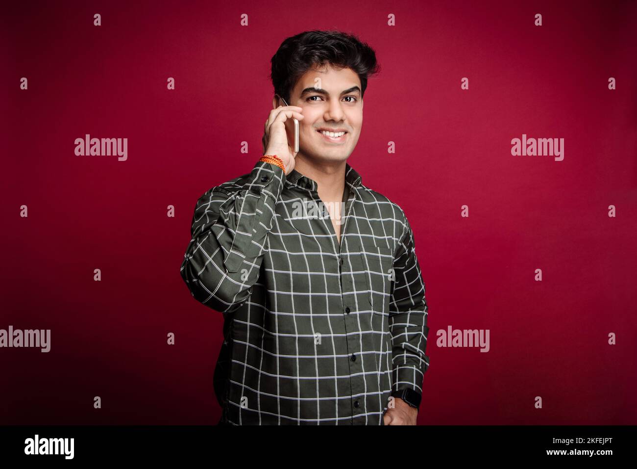 Handsome Man Engaged in a Phone Conversation, Exuding Confidence and ...