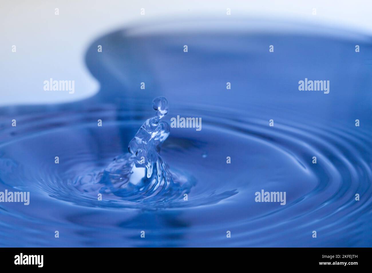 Water Drop with Ripples on water surface Stock Photo - Alamy