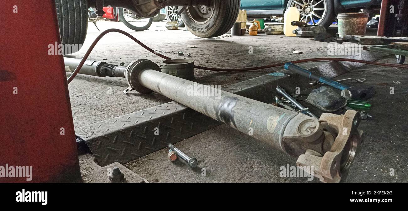 axle parts of a car that is placed on the floor Stock Photo - Alamy