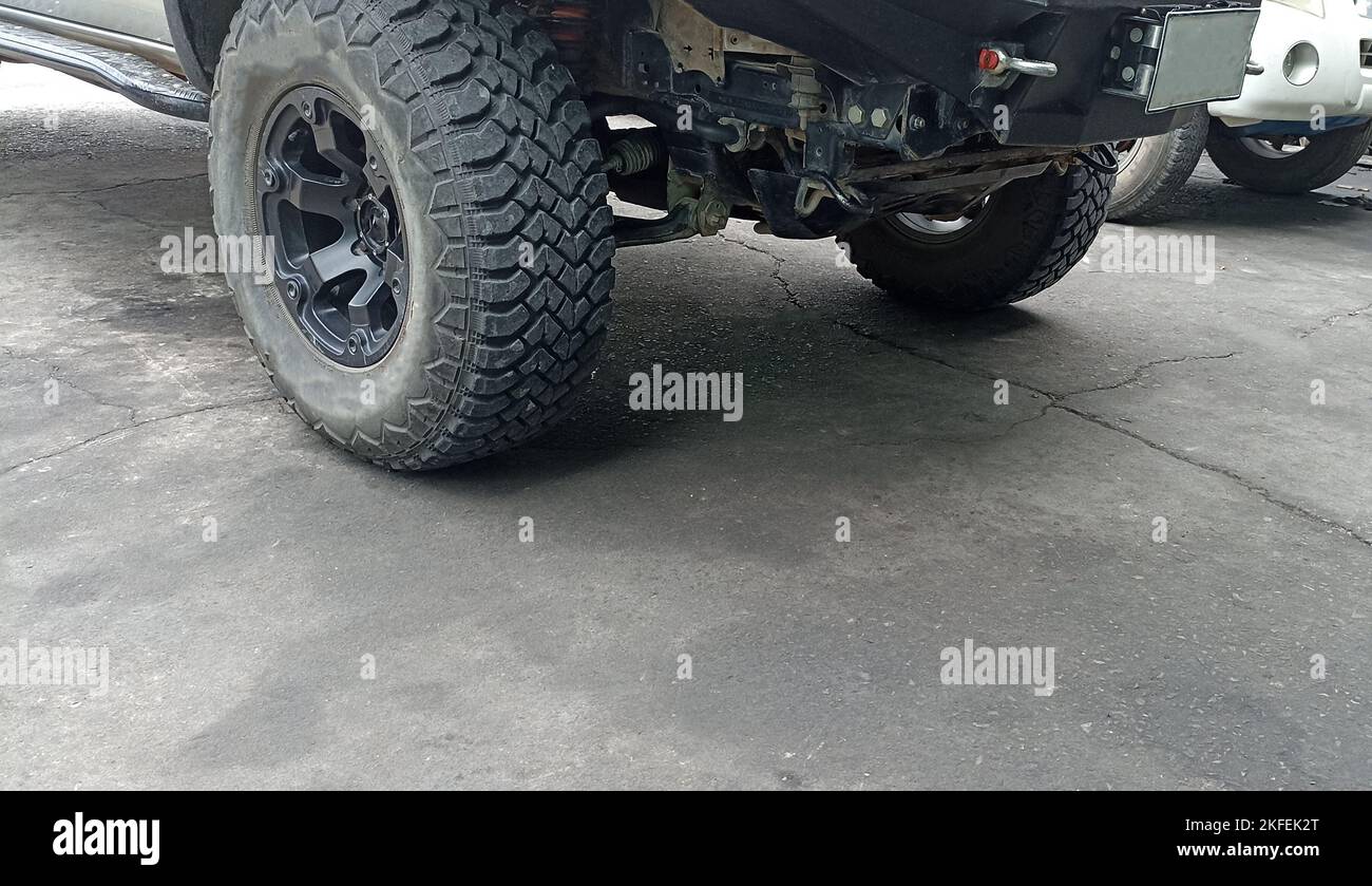 Picture of the front of the car that is raised, can see the suspension ...