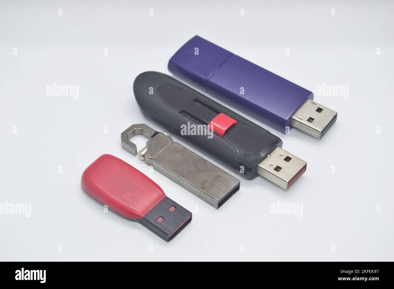 Flash drives, many shapes, old condition, placed on a white background ...