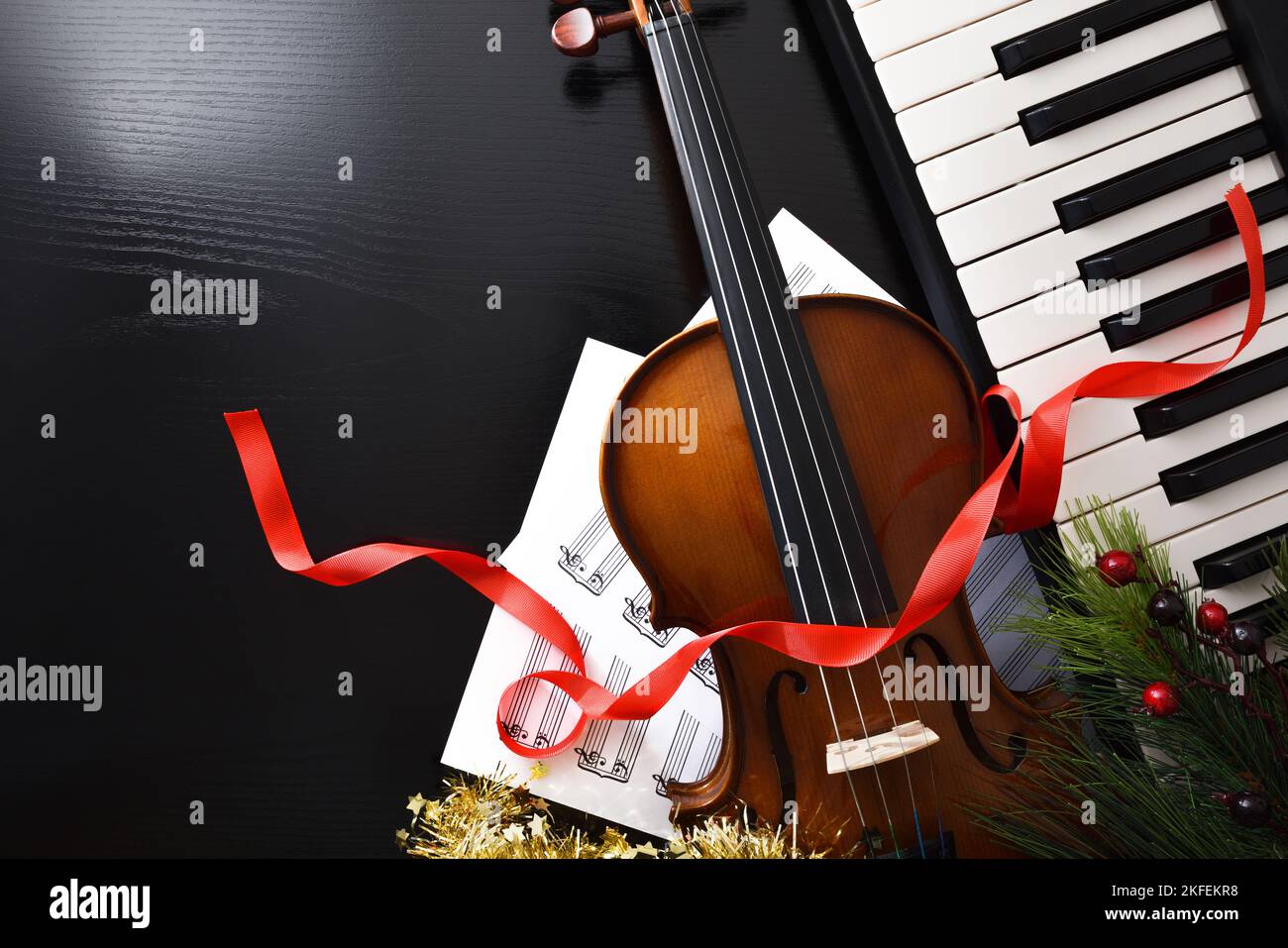 Christmas musical event concept background with piano and violin on ...