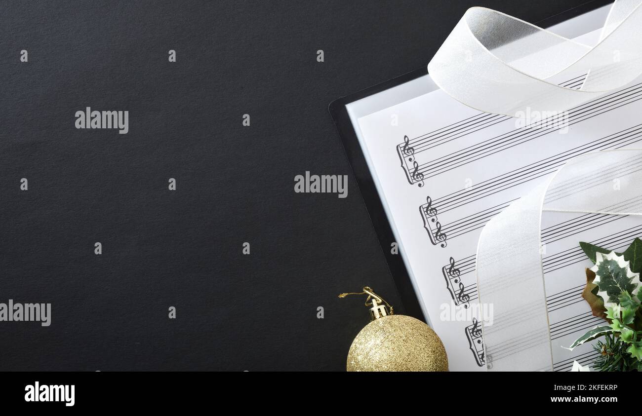 Choral christmas music performance concept background with binder with ...