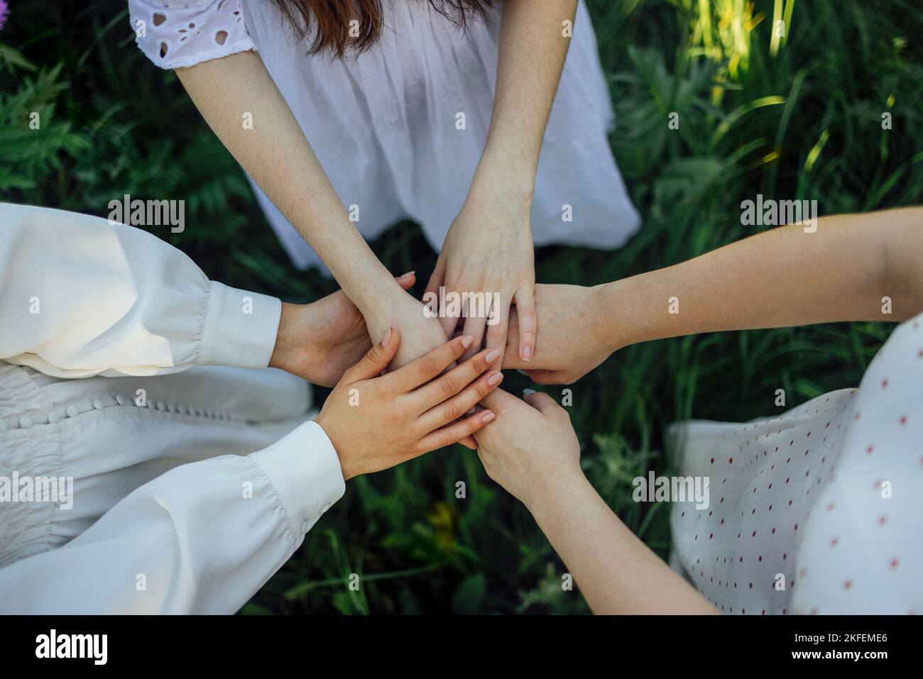 Close up of a women's hands touching the grass, feeling nature ...
