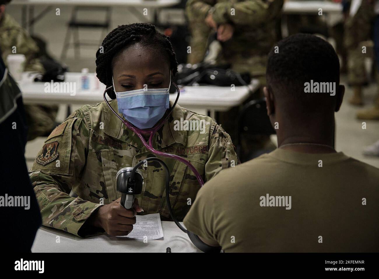 Capt. Fenella Lynch, a 105th Medical Group nurse, checks a guardsman's ...