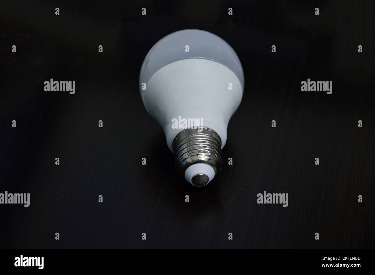 Light bulb with wood house on the table hi-res stock photography and ...