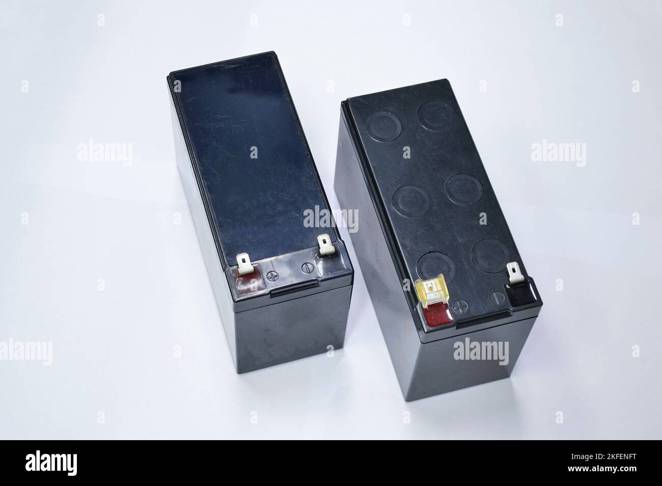 2 batteries placed on a white background (old batteries Stock Photo - Alamy