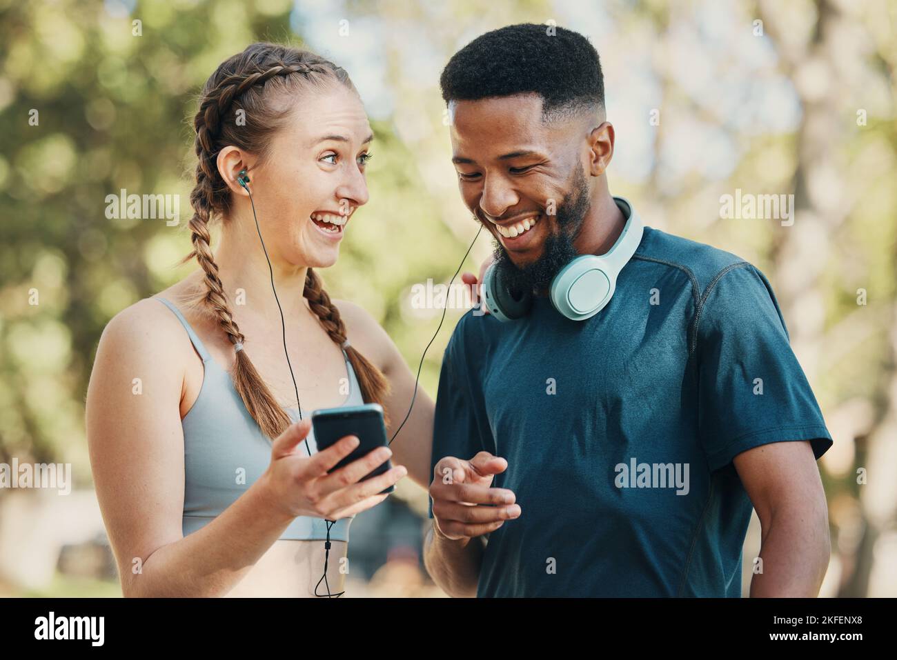 Phone, music and fitness with a diversity couple listening to audio ...