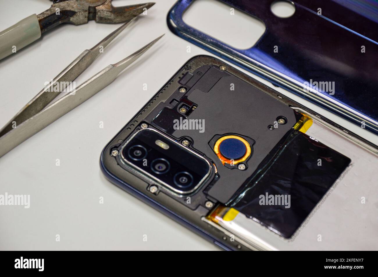 The back corner of the mobile phone has been removed Stock Photo - Alamy