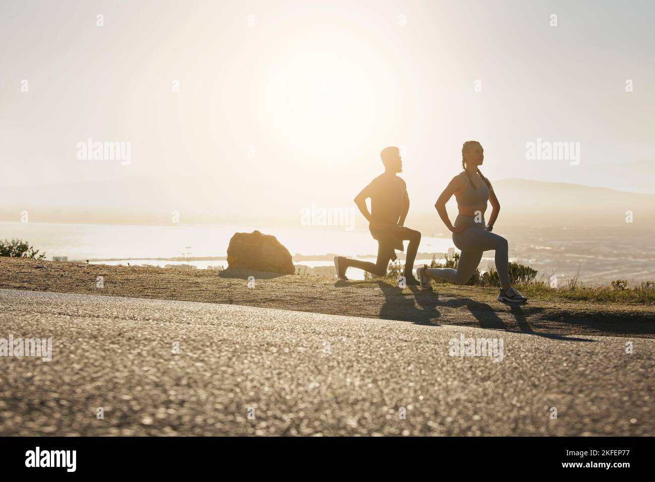 Man, woman or fitness stretching at sunset for exercise, training or ...