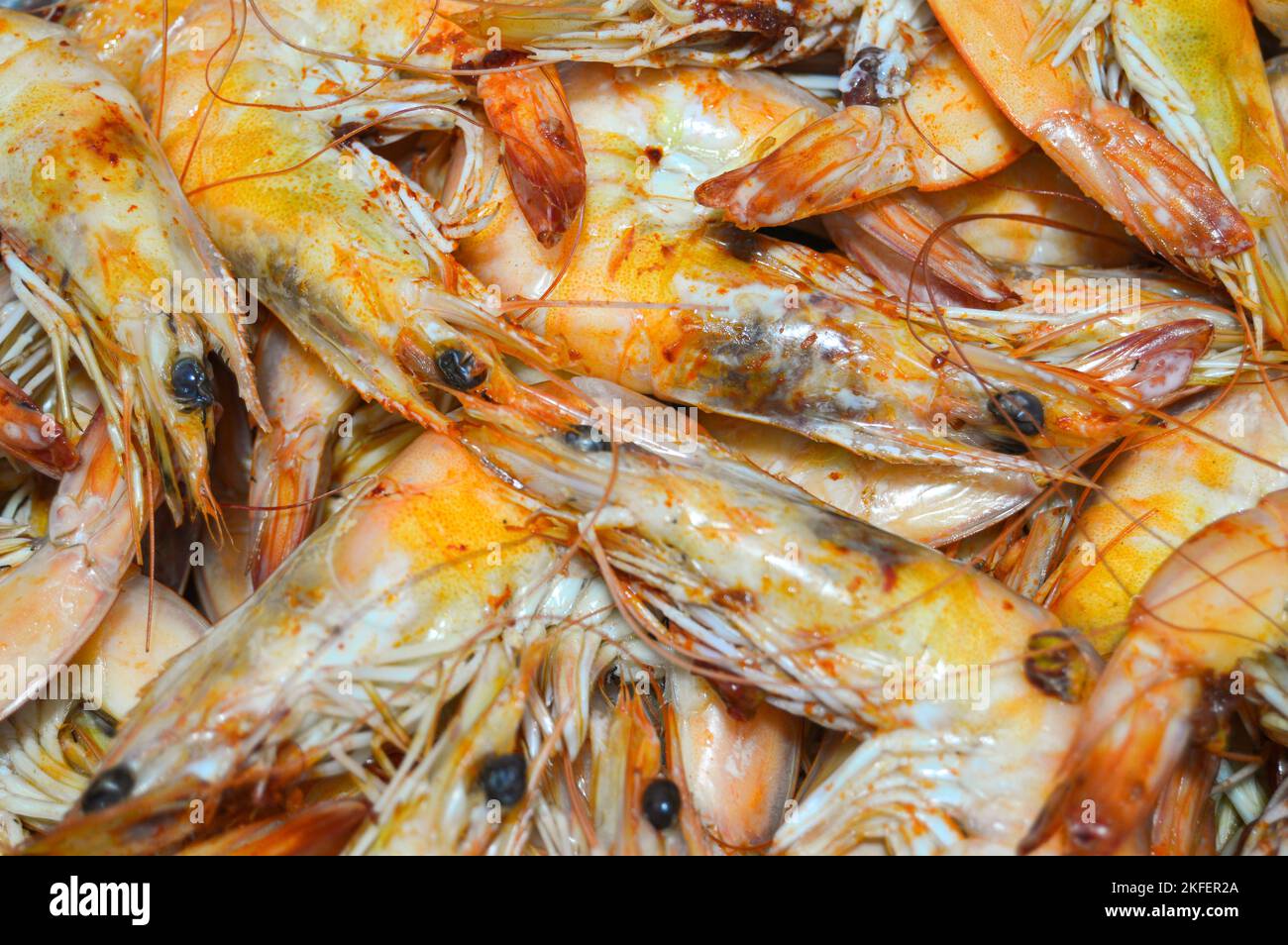 Shrimp that has been cooked through the process of cooking its color is ...