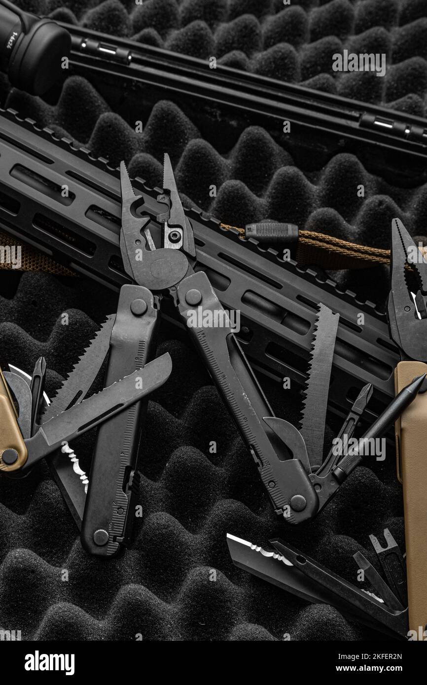 Modern multitool with many tools. A portable multi-tasking military ...