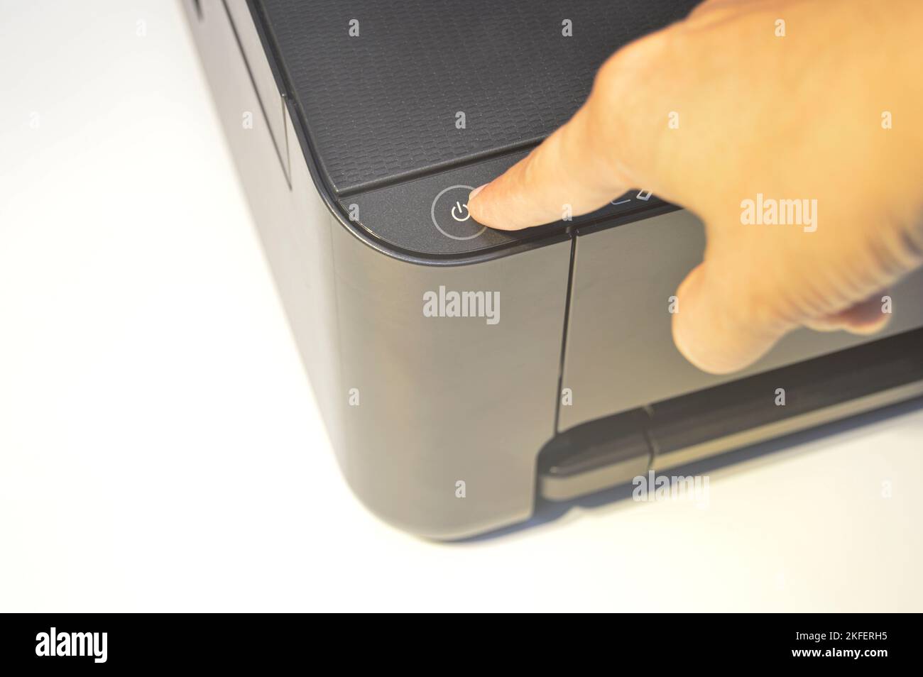 Image is pressing the power button. of the printer Stock Photo - Alamy