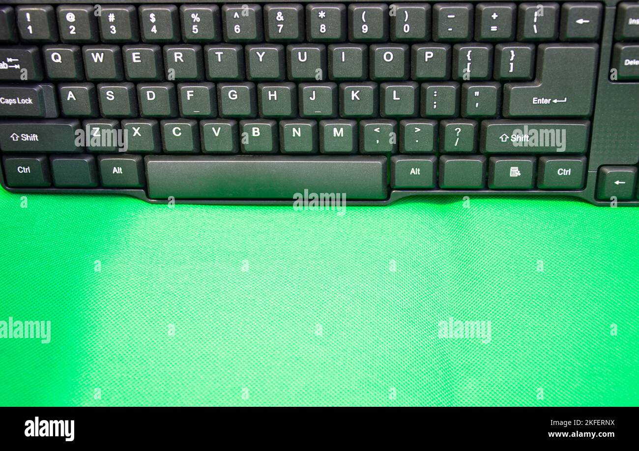 front view of keyboard keys placed on a green background Stock Photo ...