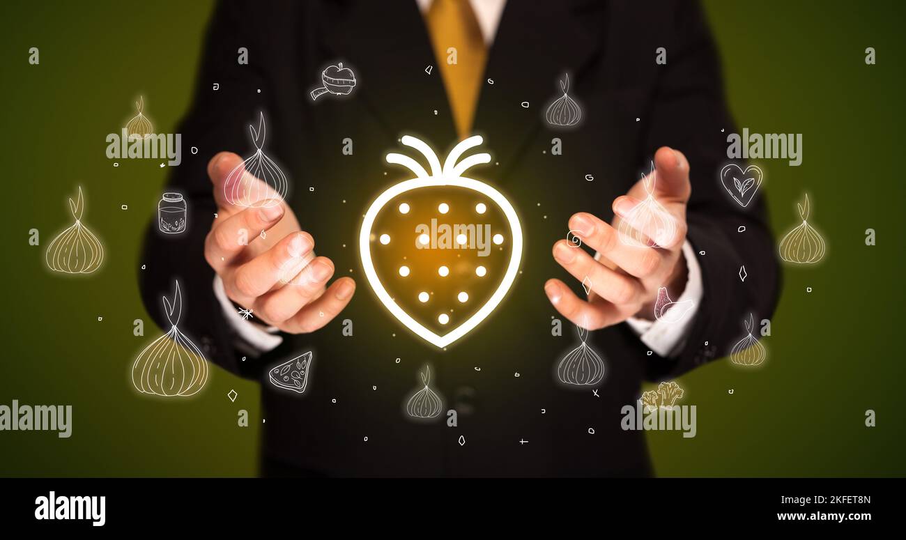 Hand holding food related icons Stock Photo - Alamy
